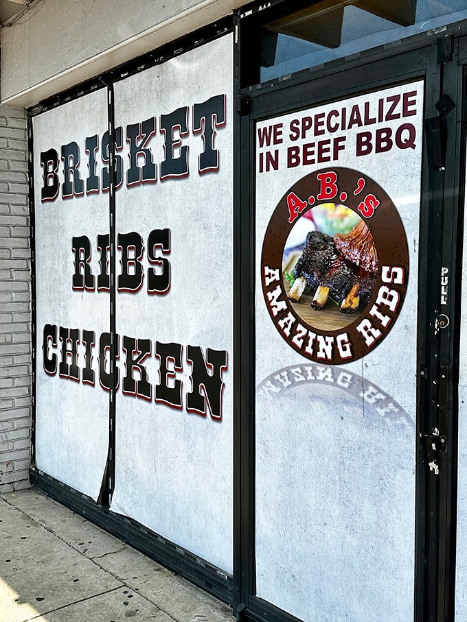 The entrance tells you exactly what you need to know—brisket, ribs, chicken, and a promise of "amazing" that isn't just marketing, but a solemn vow.