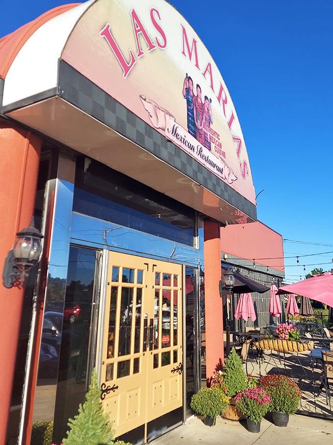Golden doors framed by the restaurant's signature arch – the gateway to your next favorite Mexican meal in Greenville.