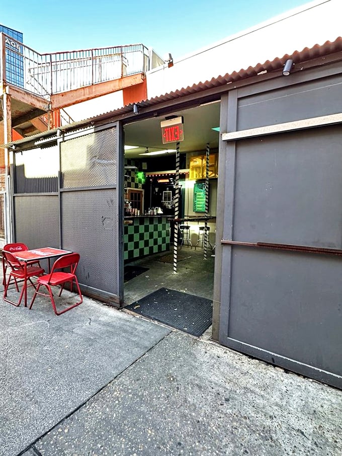 The entrance at dusk—an unassuming doorway that separates the uninitiated from those who know where Austin's taco magic really happens.