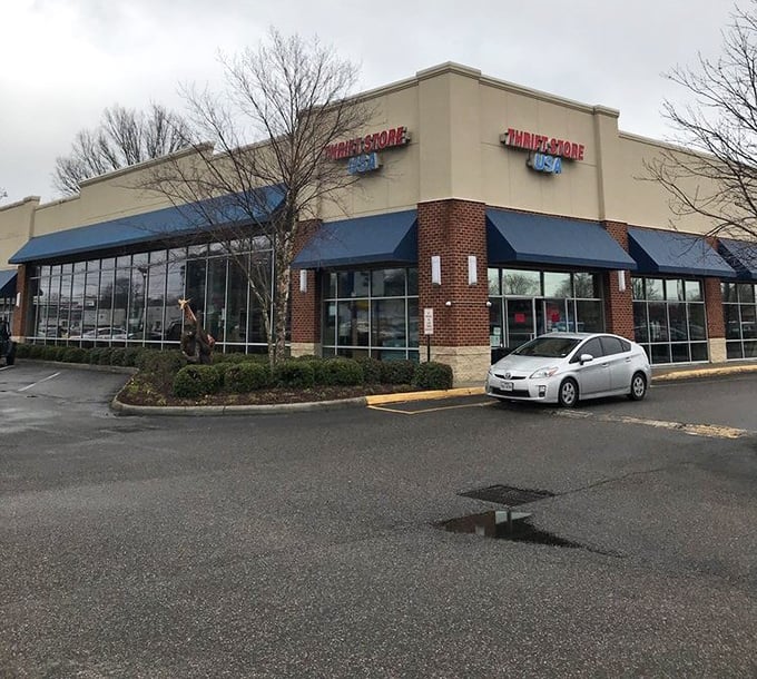 The corner view of Thrift Store USA on a rainy day—even gray skies can't dampen the colorful bargain hunting experience waiting inside.