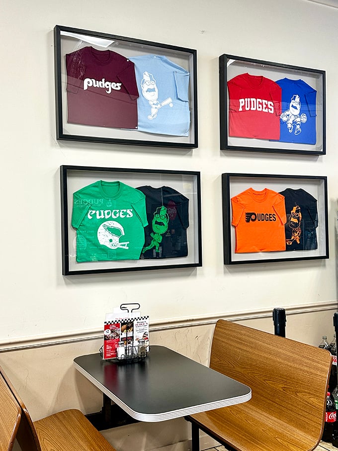 Framed t-shirts on display like the sandwich hall of fame they are. Even the merchandise celebrates the mustachioed mascot who oversees this temple of taste.