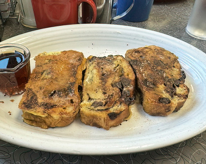 French toast that's been transformed into something magical—where bread transcends its humble origins to become breakfast nobility.