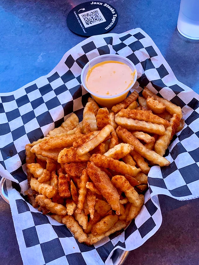 Crinkle-cut fries with cheese sauce—the supporting actor that sometimes steals the show from the sandwich headliners.