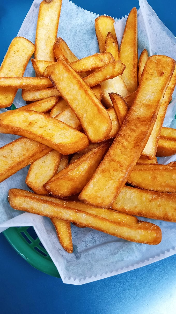 These aren't just fries—they're golden wands of potato perfection, ready to soak up any wayward cheesesteak juices that might escape your sandwich.