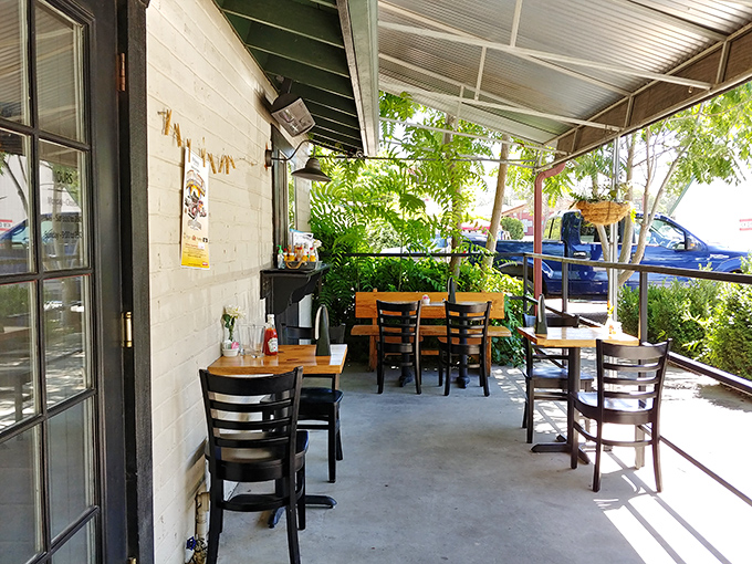The covered patio offers that perfect middle ground between indoors and outdoors – protection from elements while still feeling connected to nature.