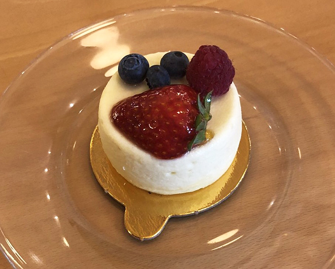 This isn't just cheesecake – it's a blank canvas where berries perform their delicious ballet of sweet and tart perfection.