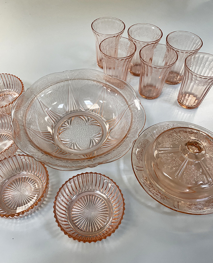 Depression glass treasures in delicate pink—these aren't just dishes, they're time machines to grandmother's Sunday dinner table.
