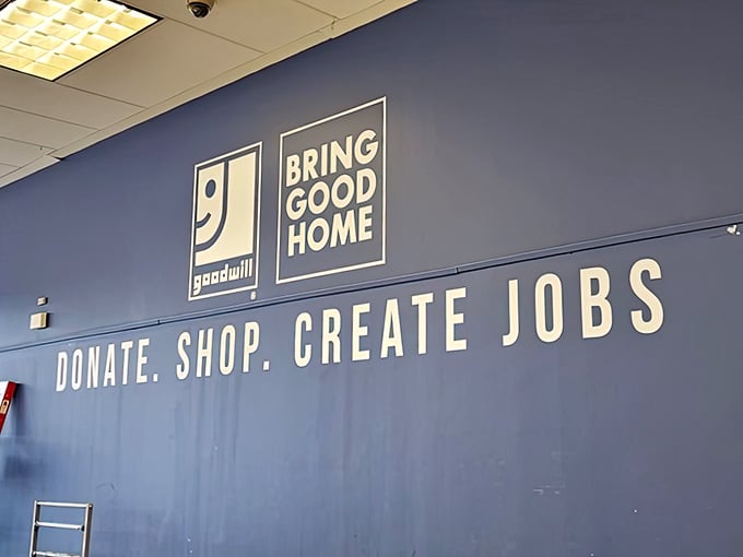 The mission statement wall reminds us that every purchase powers something greater—turning yesterday's donations into tomorrow's jobs.