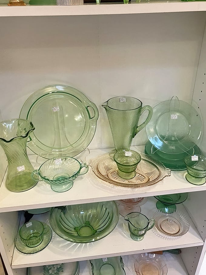 Depression glass in delicate green hues captures the light like liquid emeralds—kitchen treasures from grandmother's era that never go out of style.