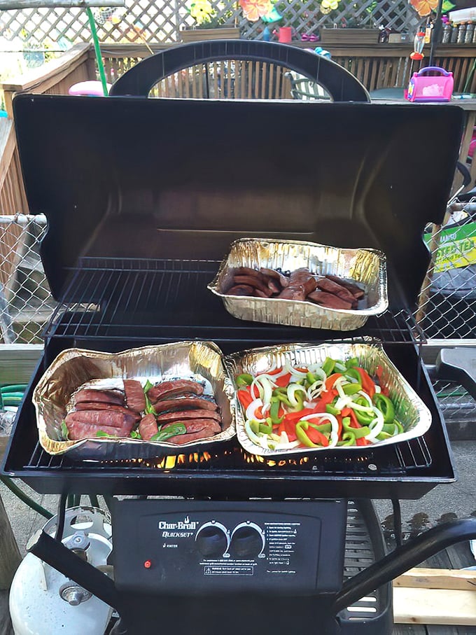 Kielbasa and peppers on the grill—proof that sometimes the simplest preparations yield the most profound flavors.