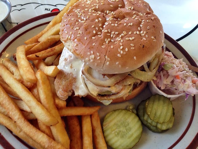 This isn't just a sandwich—it's a towering achievement of grilled chicken, melted cheese, and fresh veggies that requires both hands and a strategy.