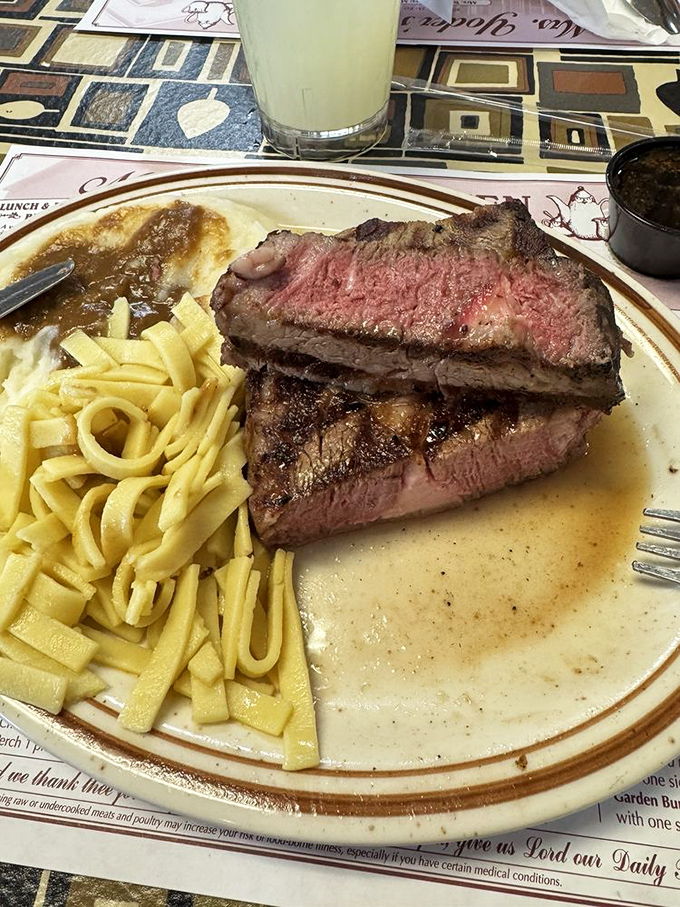 This prime rib isn't just cooked—it's been treated with respect. Those butter noodles are the unsung heroes of the plate, ready to soak up every drop of jus. 