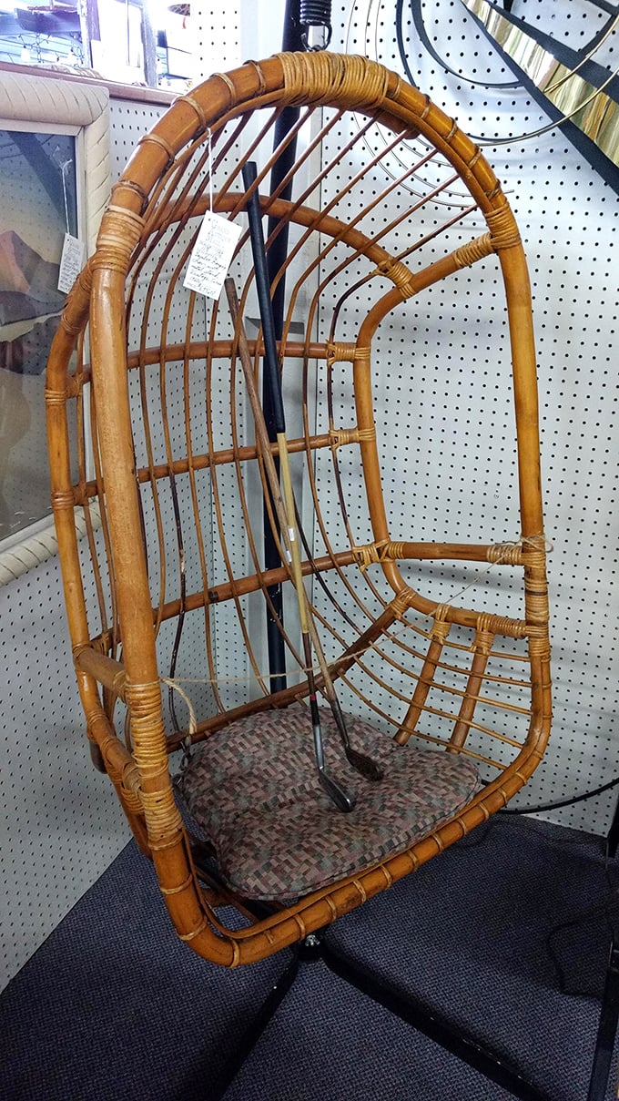 A hanging rattan chair that screams 1970s bohemian chic. This isn't just furniture—it's a time machine to an era when macramé was considered high art.