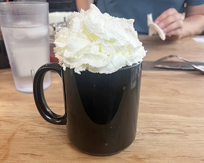 Hot chocolate that wears a cloud – this mug doesn't just warm your hands, it lifts your spirits with its whipped cream mountain.