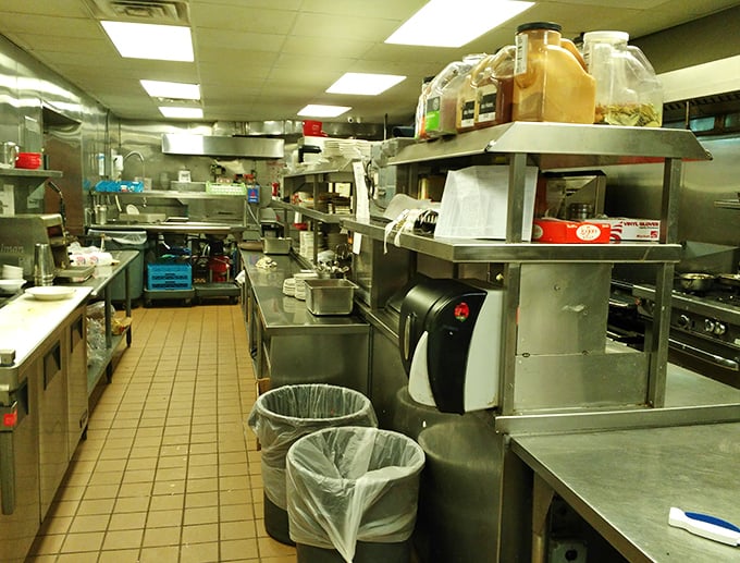Behind the scenes in the kitchen, where the magic happens on well-seasoned grills that have likely produced thousands of perfect over-easy eggs.