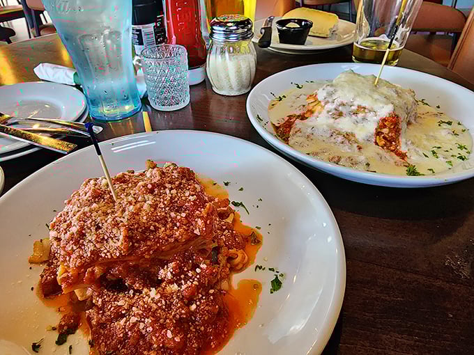 A tale of two pastas—one robust with marinara courage, the other creamy with alfredo comfort. This isn't just dinner; it's a choose-your-own-adventure in Italian form.