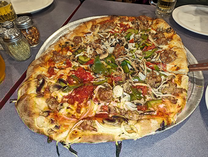 The "Works" in all its glory—a pizza so loaded it requires structural engineering and an appetite of equal ambition.