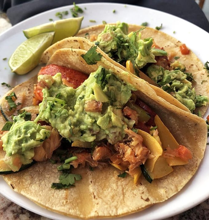 Lobster tacos topped with generous avocado—California's way of saying "we take our taco responsibility very seriously around here."