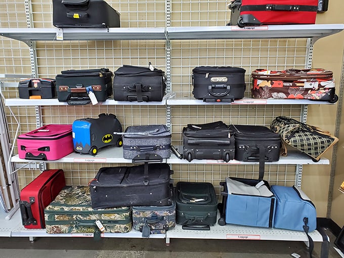 The luggage section—where someone's abandoned vacation dreams become your carry-on solution at a fraction of department store prices.