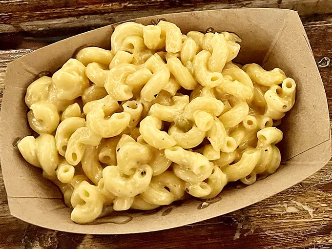 Mac and cheese that doesn't just accompany the BBQ—it demands equal billing. Creamy, cheesy perfection in a humble paper boat.