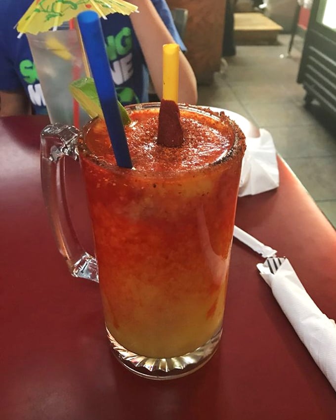 A mangonada that's part drink, part dessert, all celebration. Those colorful straws aren't just for sipping—they're for extending the joy.