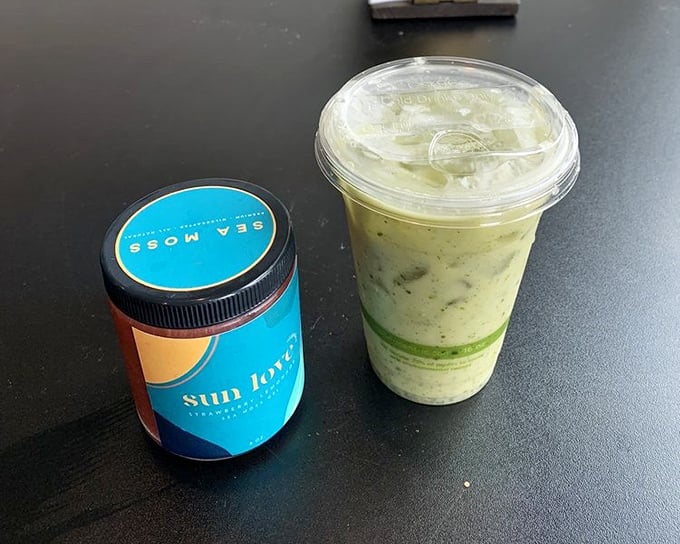 That vibrant green matcha latte isn't just a beverage—it's a wellness trend in a cup, sitting beside what might be the most hipster condiment ever.
