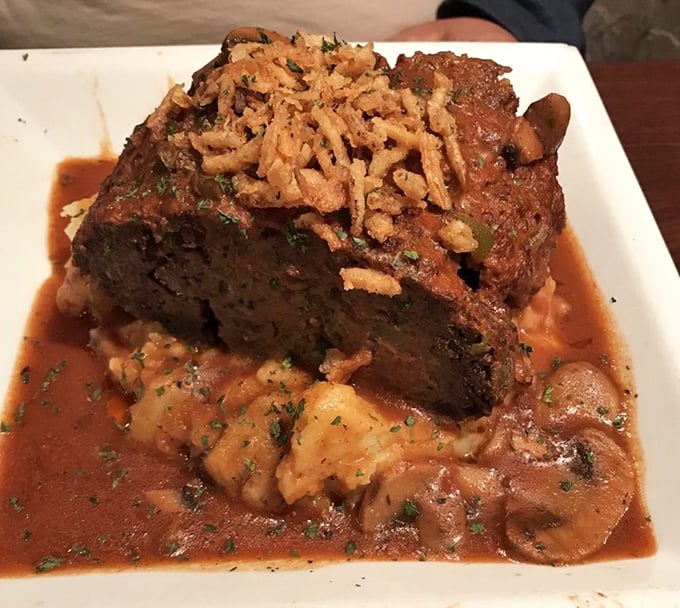 The legendary meatloaf in all its glory! Perched atop creamy mashed potatoes with savory gravy, it's the dish that launched a thousand return visits.