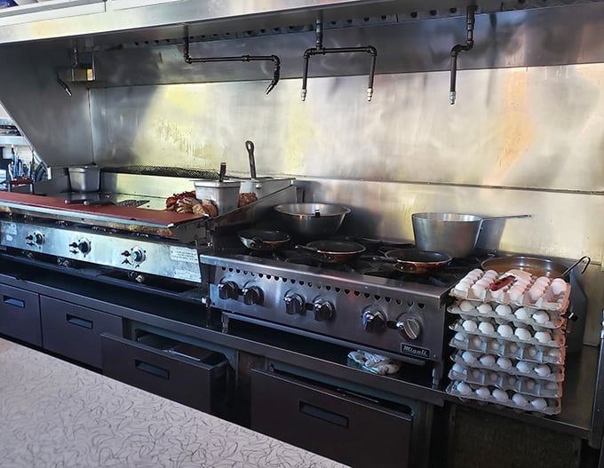 The beating heart of Howley's—an open kitchen where breakfast alchemy happens before your eyes. Those eggs aren't just cooking; they're performing!