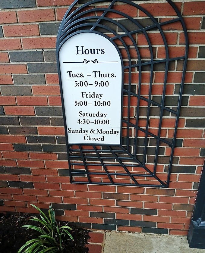 The hours posted clearly on brick—because when you serve food this good, people need to know exactly when they can get it.
