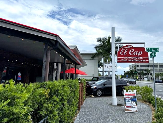 Florida sunshine and El Cap's classic sign—a match made in burger heaven. This corner has been drawing hungry pilgrims for over half a century. 