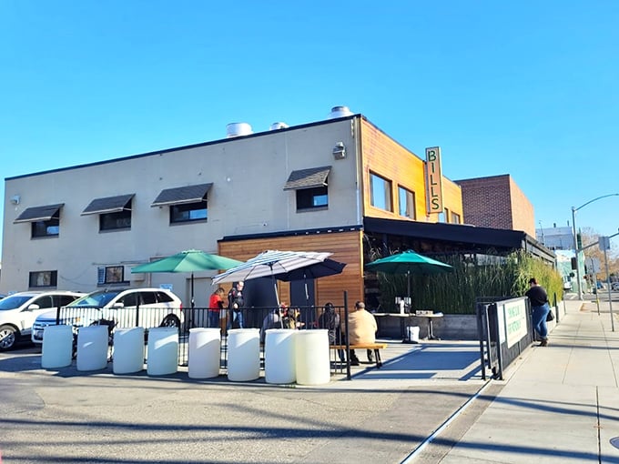 Al fresco dining under the partial shade of umbrellas—where the morning breeze carries conversations and the scent of bacon to neighboring tables.