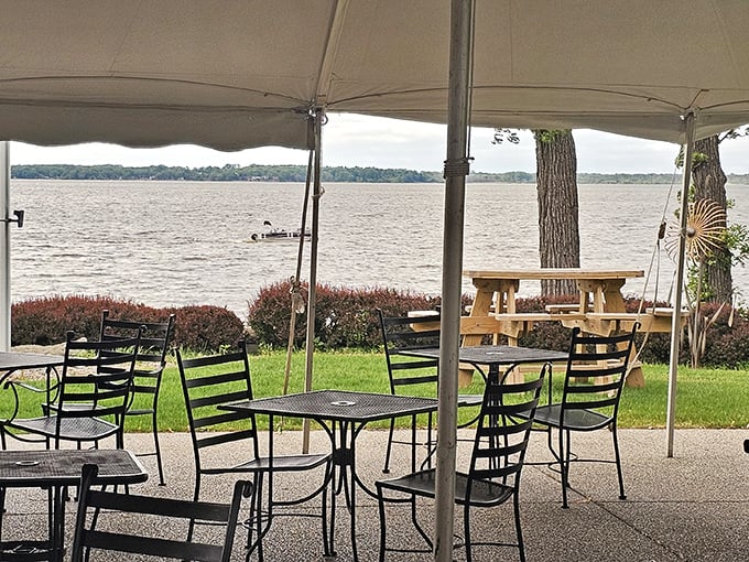 Lakeside dining under a canopy with views of Lake Koshkonong—because sometimes the best seasoning is a gentle breeze and water lapping at the shore.