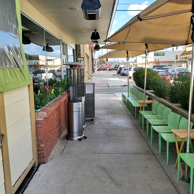 Green chairs line the sidewalk patio—a perfect perch for people-watching while waiting for your table at this beloved Bakersfield institution.