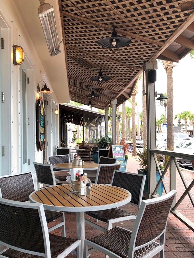 Outdoor seating that captures the essence of Florida dining—palm trees, sea breeze, and the promise of something delicious just moments away. 