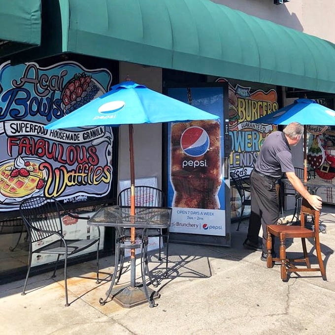 Outdoor seating with Pepsi umbrellas offers Florida's favorite dining option—enjoying great food while debating if it's too hot to eat outside.