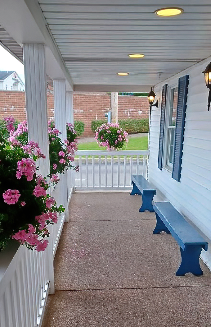 The porch's blue benches invite you to sit a spell, as Grandma would say—either before your meal (ambitious) or after (necessary).