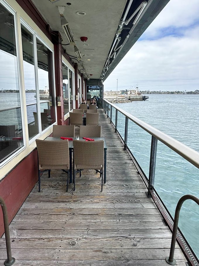 The waterfront deck offers dining with a side of ocean breeze – where every table comes with million-dollar views that no interior designer could replicate.