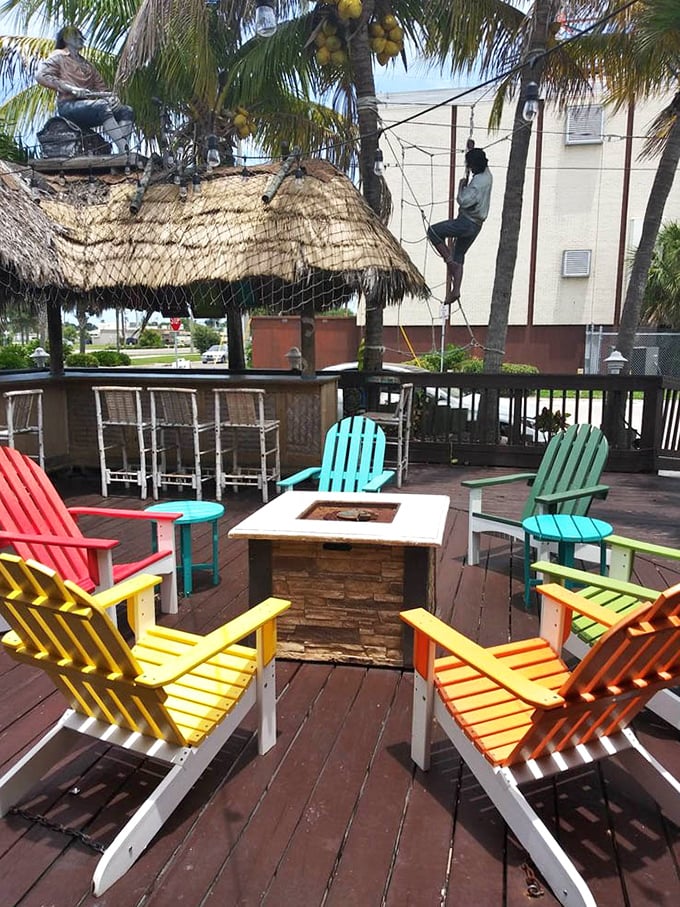 Adirondack chairs in colors brighter than your future after winning the lottery – outdoor seating designed for post-seafood contentment.