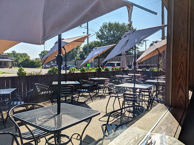 The outdoor patio at Greenbush—where summer afternoons turn into evening memories. Those umbrellas don't just provide shade—they frame perfect Michigan moments.