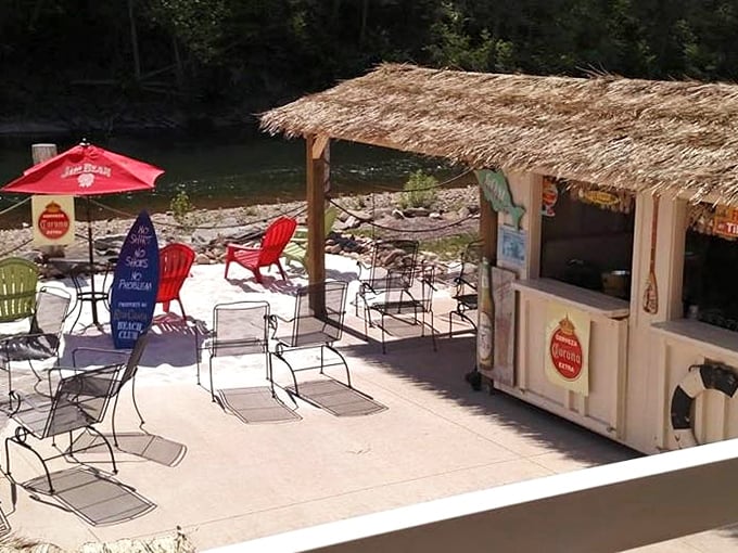 Tiki hut paradise by the Susquehanna. Those red Adirondack chairs aren't just seating—they're front-row tickets to nature's most relaxing show.