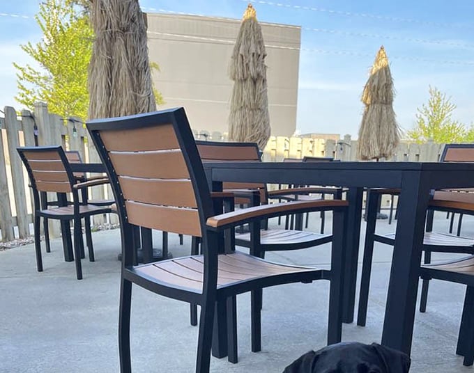 The outdoor seating area waits patiently for warmer days, like a Wisconsinite in April who's optimistically packed away their winter coat too early.