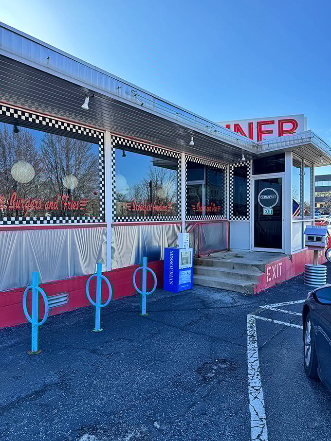 The black and white checkerboard trim says "classic diner," but the blue bike racks whisper "we're cooler than you think."