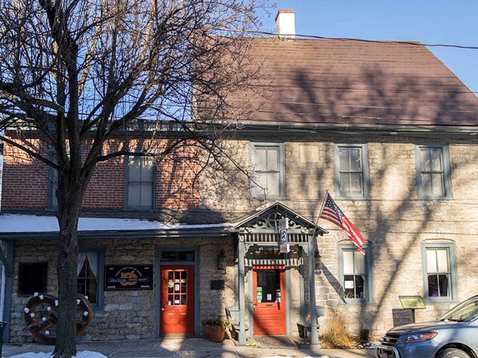 Winter can't diminish the charm of this historic bakery—the stone walls and red doors stand ready to welcome pretzel pilgrims regardless of season.