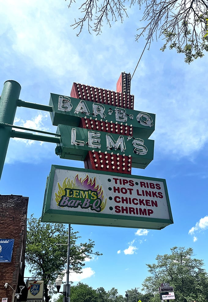 That vintage sign against a blue Chicago sky—not just advertising barbecue, but announcing a neighborhood institution that's stood the test of time.