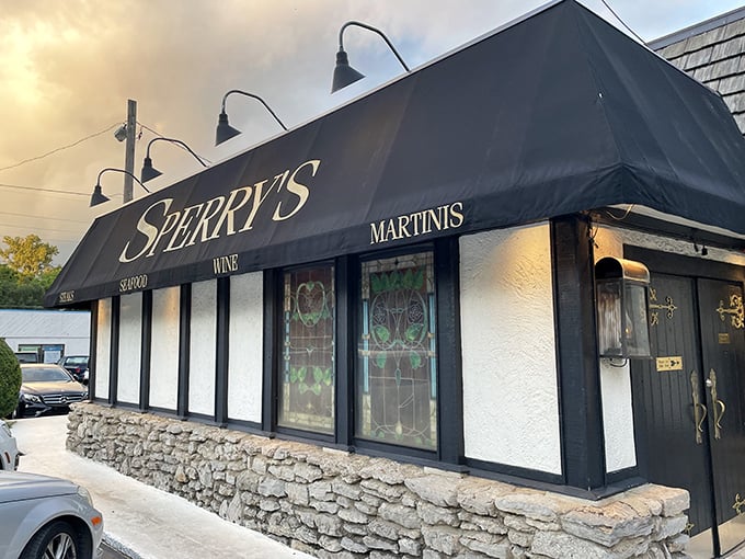 The exterior may be humble, but that black awning with "WINE" and "MARTINIS" tells you everything you need to know. Priorities firmly in order. 