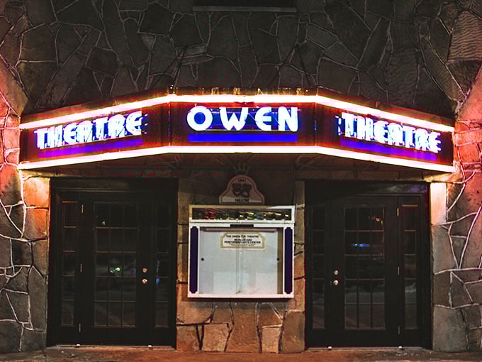 The Owen Theatre's vintage neon sign glows with the promise of entertainment that brings the community together – no streaming service required.