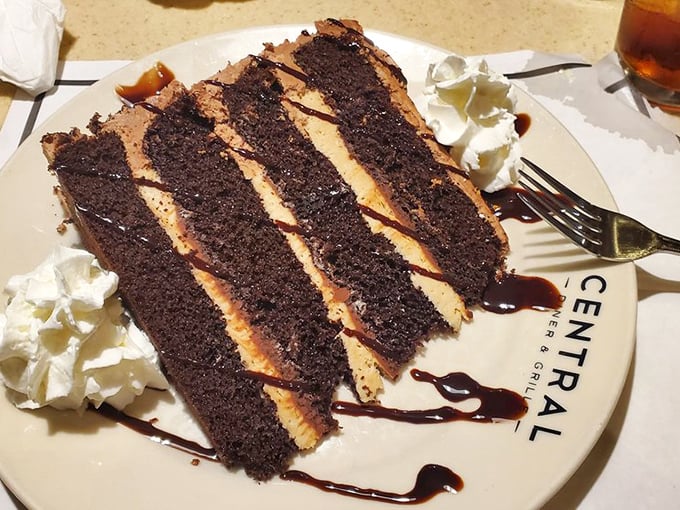 A chocolate cake with peanut butter frosting so perfectly layered it could teach geometry classes. Dessert architecture at its most delicious.