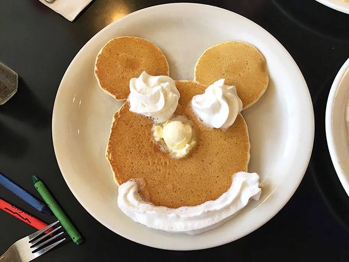 Mickey Mouse pancakes: where childhood joy meets adult-sized hunger. Whipped cream ears never tasted so good.