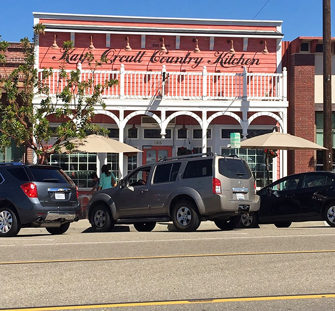 The view from across the street reveals Kay's in all its small-town glory. That coral building isn't just a restaurant—it's a landmark that orients hungry locals like a delicious North Star.
