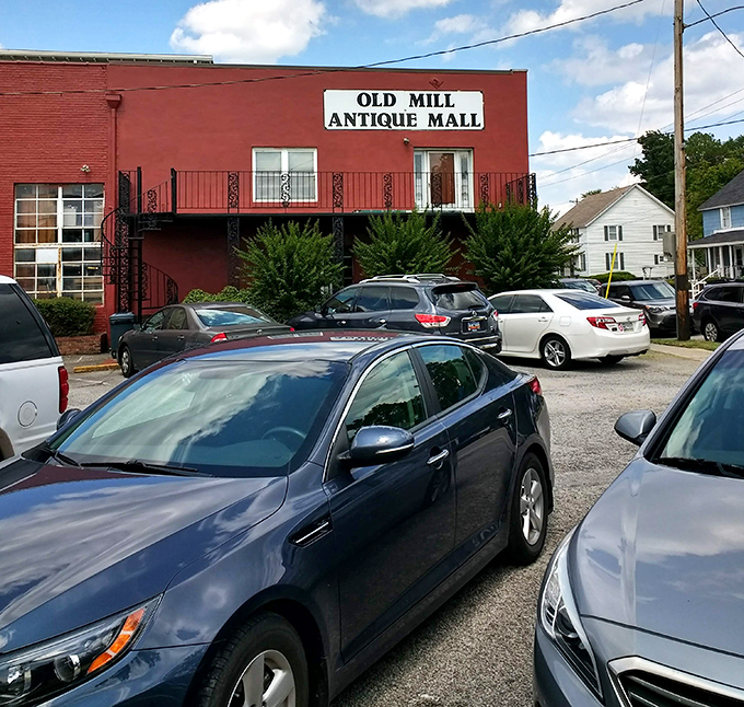 The sign says it all—Old Mill Antique Mall, where your car might be the newest thing in the parking lot, but inside, every decade awaits your discovery.
